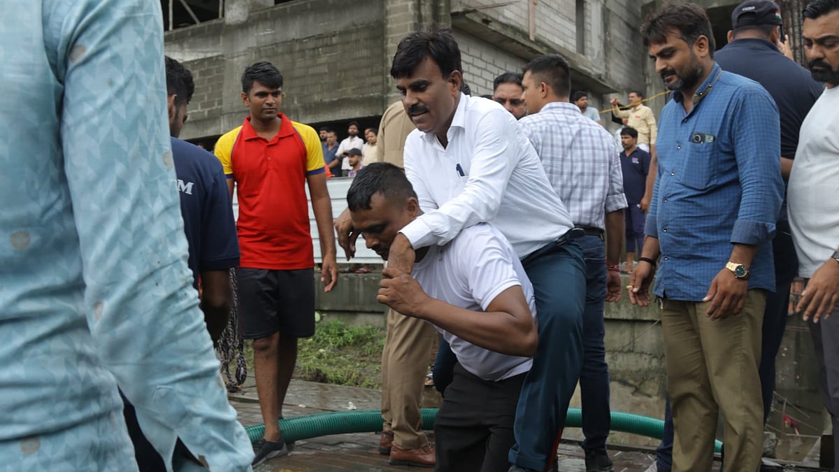 Surat deputy mayor takes piggyback ride during visit to flood-hit area