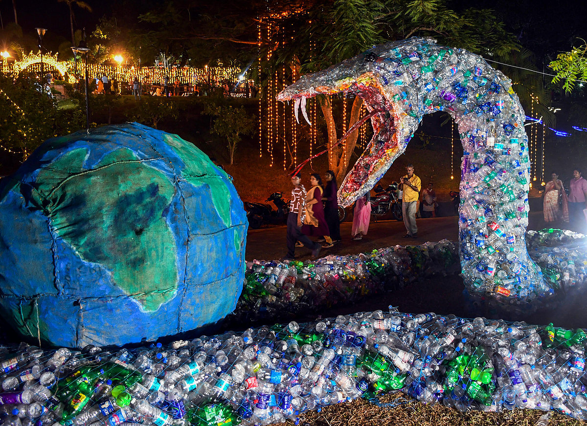 90-foot-long snake about to swallow globe -- installation art made out ...