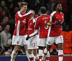 Bendtner's hat-trick sends Arsenal into quarter-finals