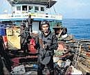 Pirate ship captured, 52 held
