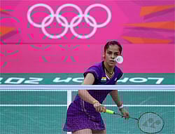 Saina begins Olympic medal bid on strong note