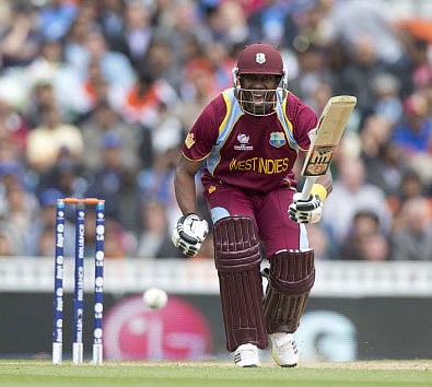 Sammy lifts WI to 233/9 after Jadeja's career-best show