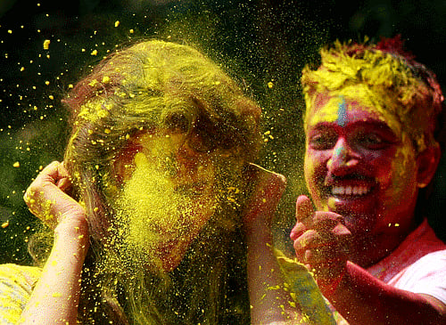 Colours rule streets as people celebrate Holi