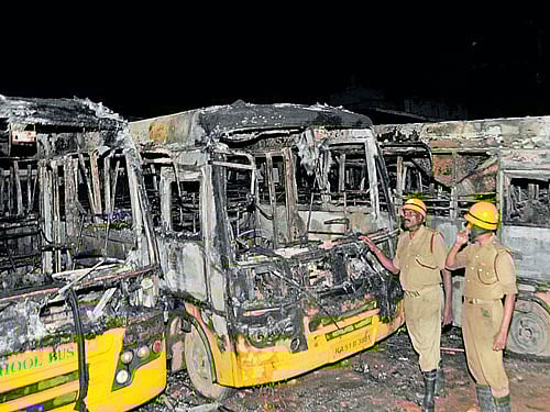 8 school vans gutted on DPS premises