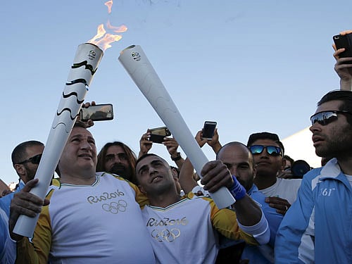 Syrian athlete carries Rio flame in Greek refugee camp
