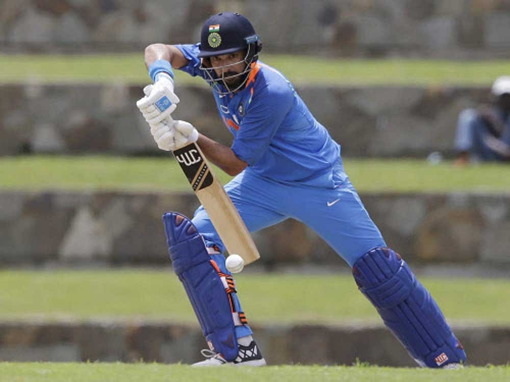 Rahane, Dhoni push India to 251/4