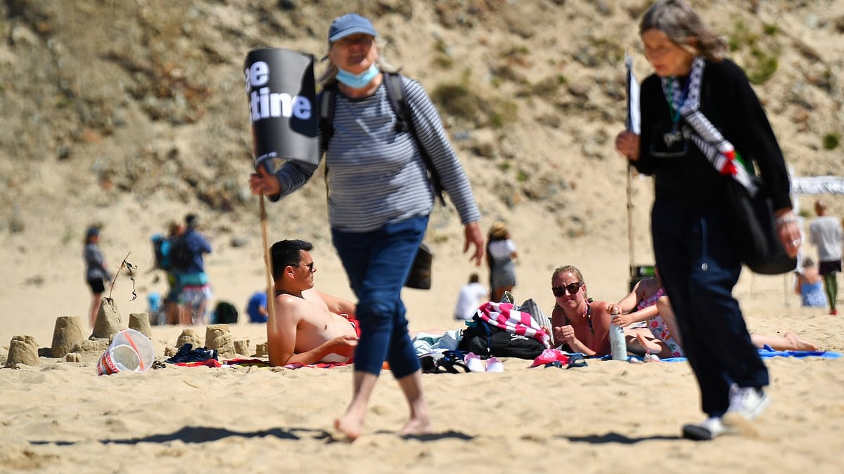 Climate change protests hit beach near G7 summit
