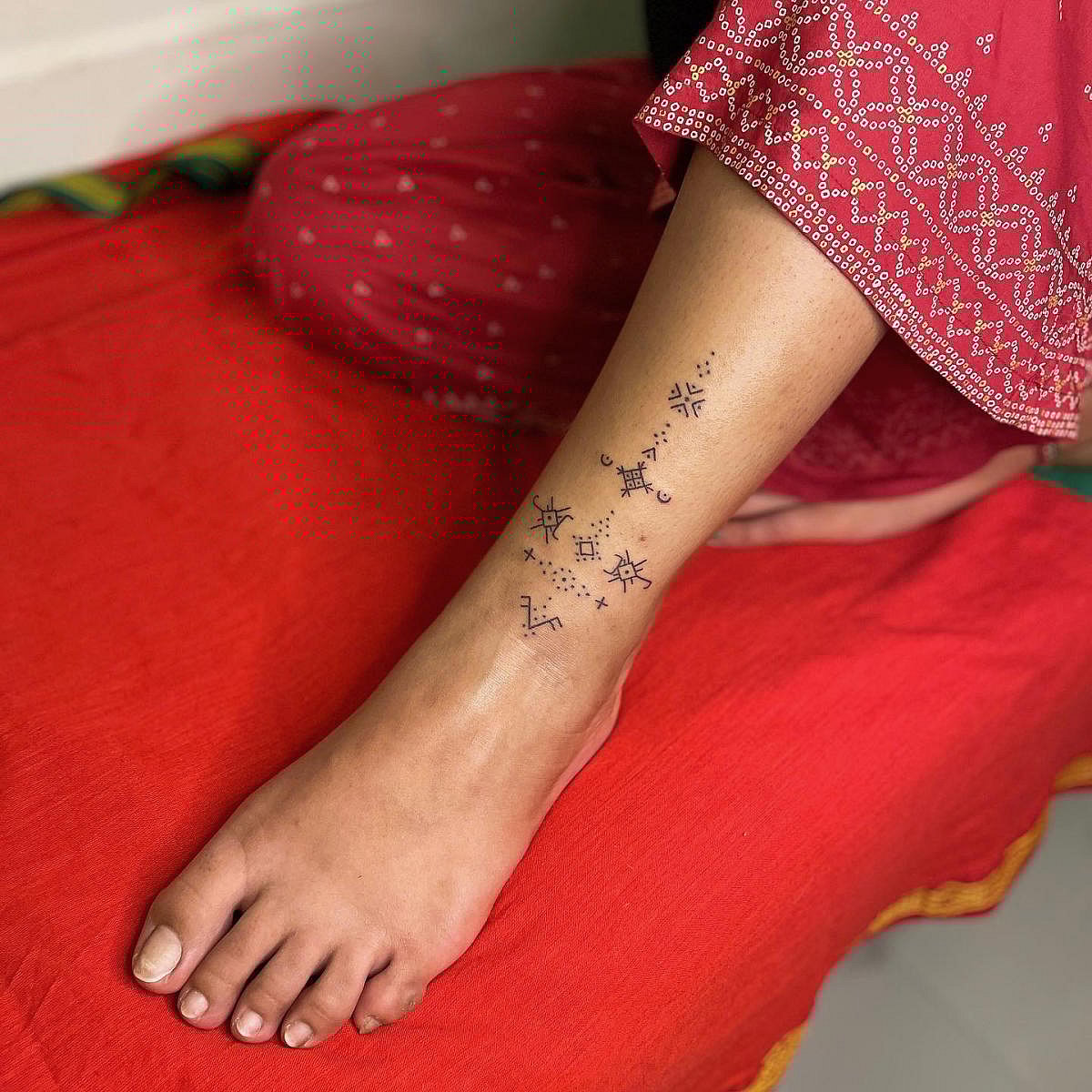 Hand-poked tattoos are in