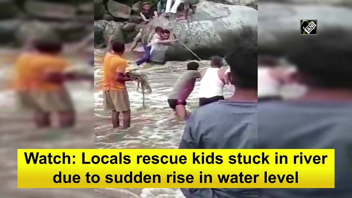 Locals rescue kids stuck in river as water-level rise